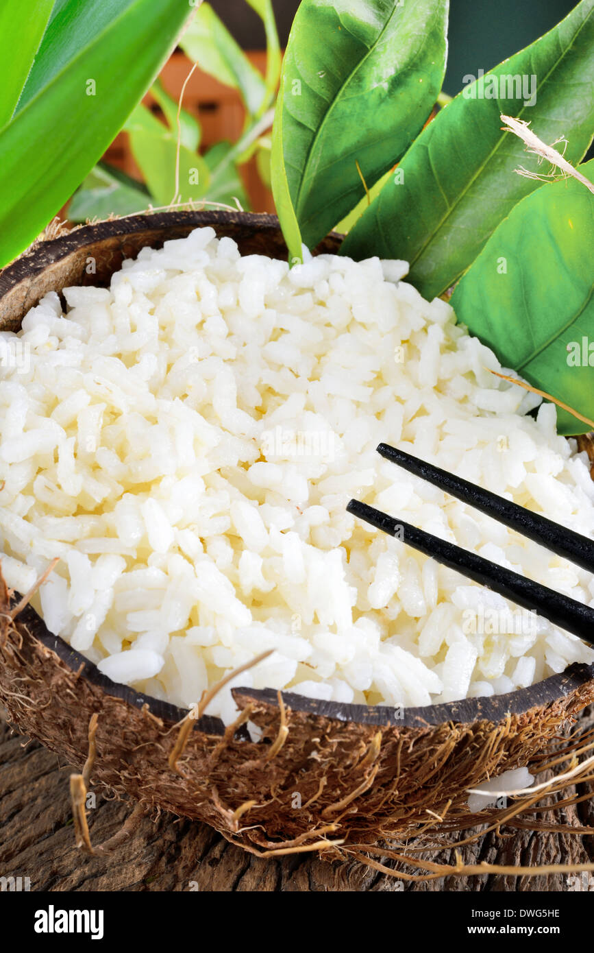 Chinese polished white boiled rice in coconut emptied Stock Photo - Alamy