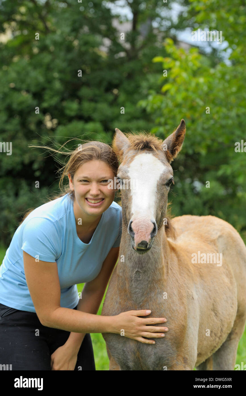 Woman cuddling horse hi-res stock photography and images - Alamy