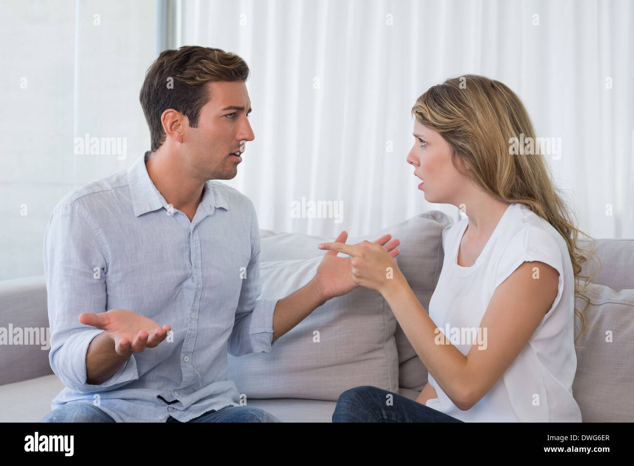 Couple having fight in living hi-res stock photography and images - Alamy