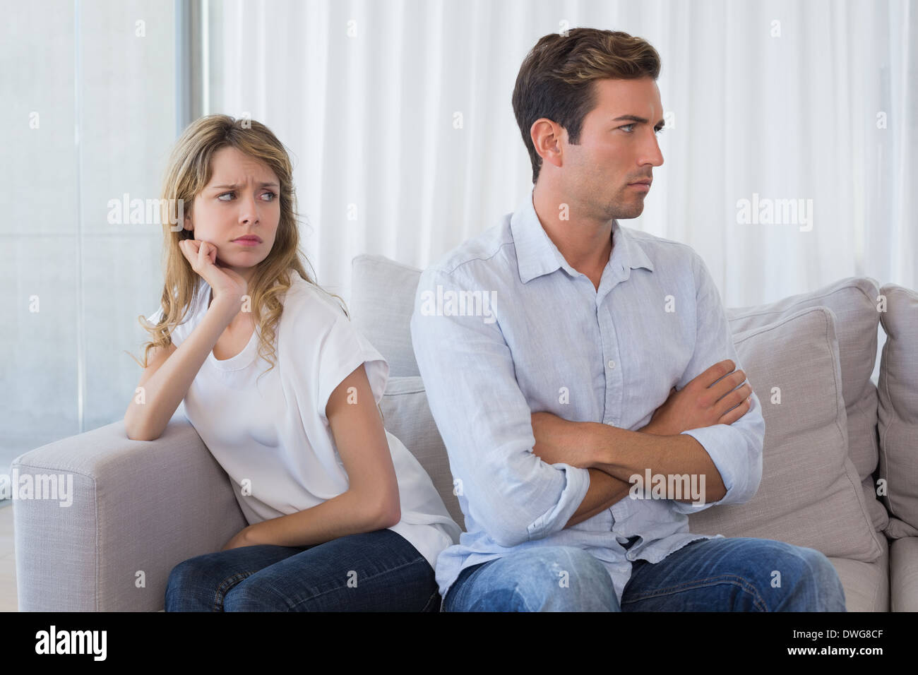 Young couple talking living room hi-res stock photography and images ...