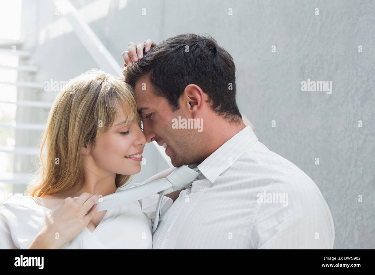 Side view of a loving couple with eyes closed Stock Photo - Alamy