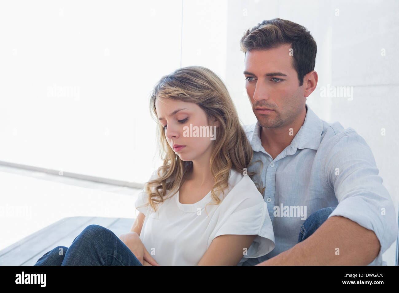 Couple sofa looking up unhappy hi-res stock photography and images - Alamy