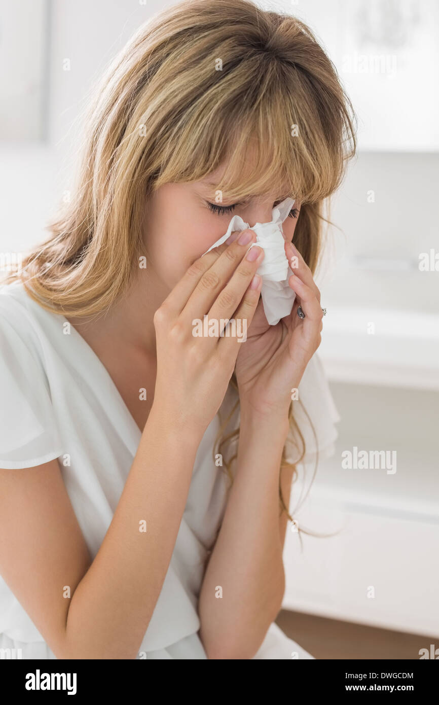 Sad young woman crying in bathroom Stock Photo - Alamy