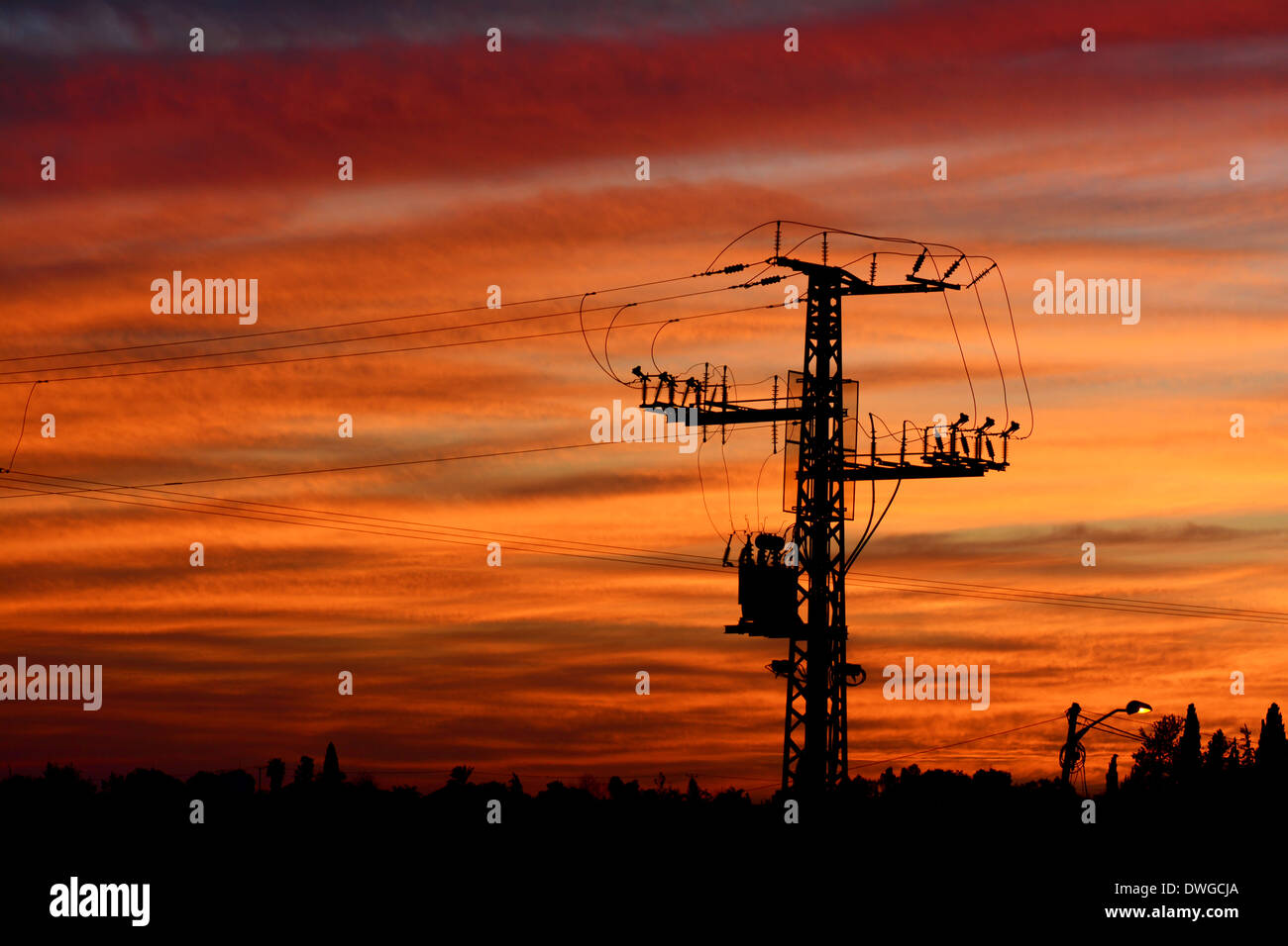 Electricity pole at sunset Stock Photo - Alamy