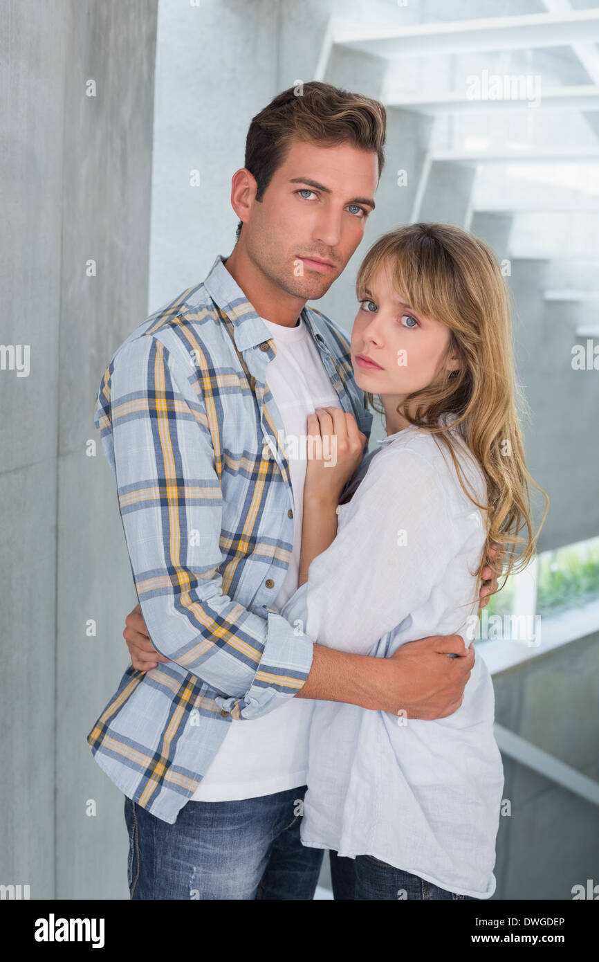 Loving young man embracing woman Stock Photo - Alamy