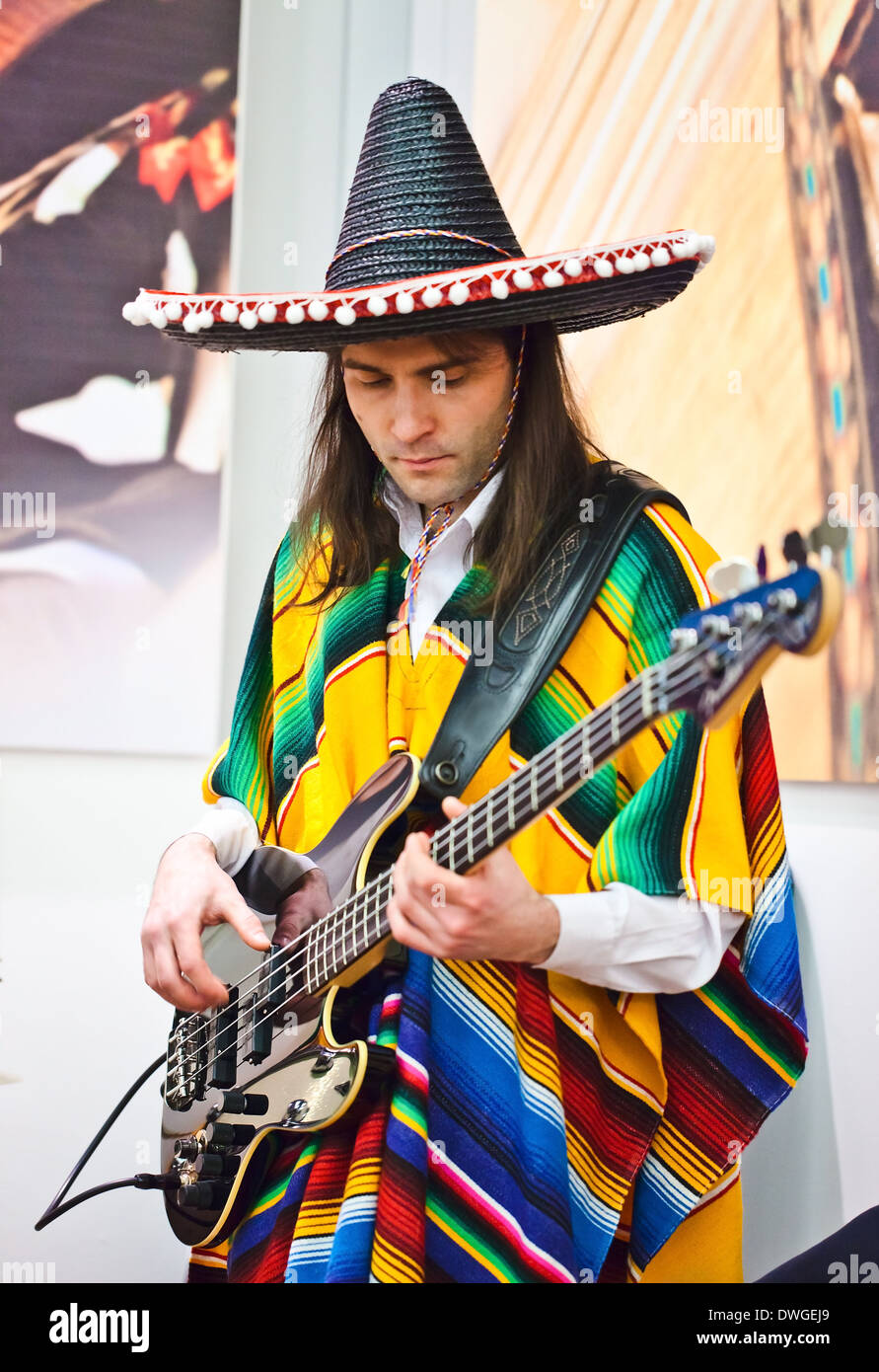 musician with a guitar in the Latin American suit Stock Photo - Alamy
