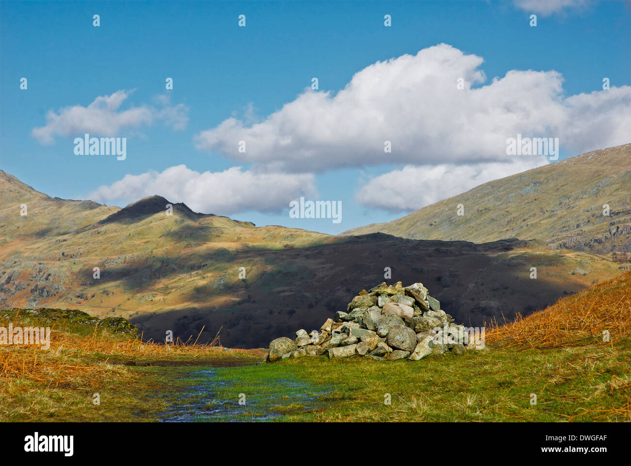 Cairn of stones on Loughrigg Fell, with view of Fairfield Horseshoe ...