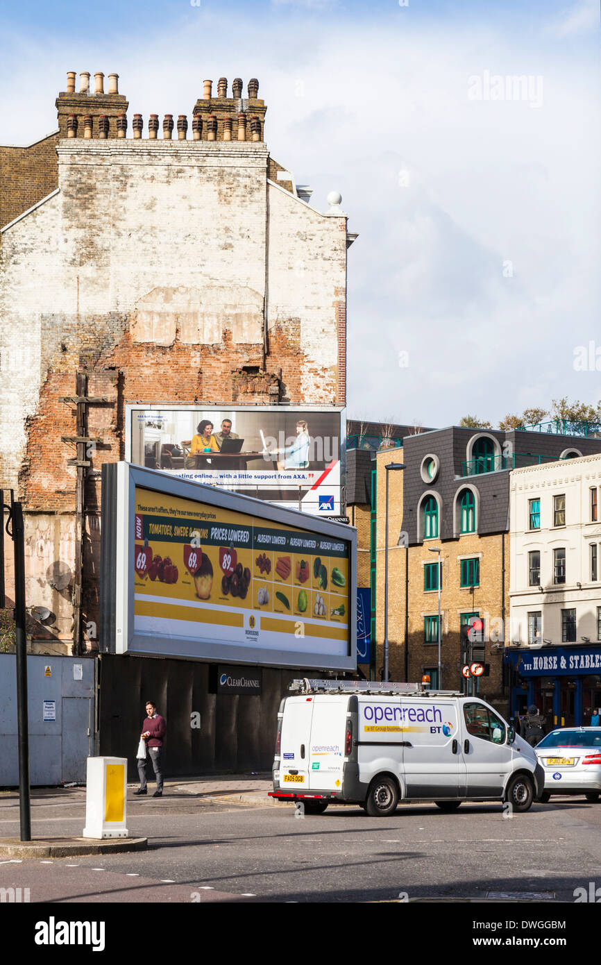 Old building, AXA and Morrisons Billboards and white BT Openreach van ...