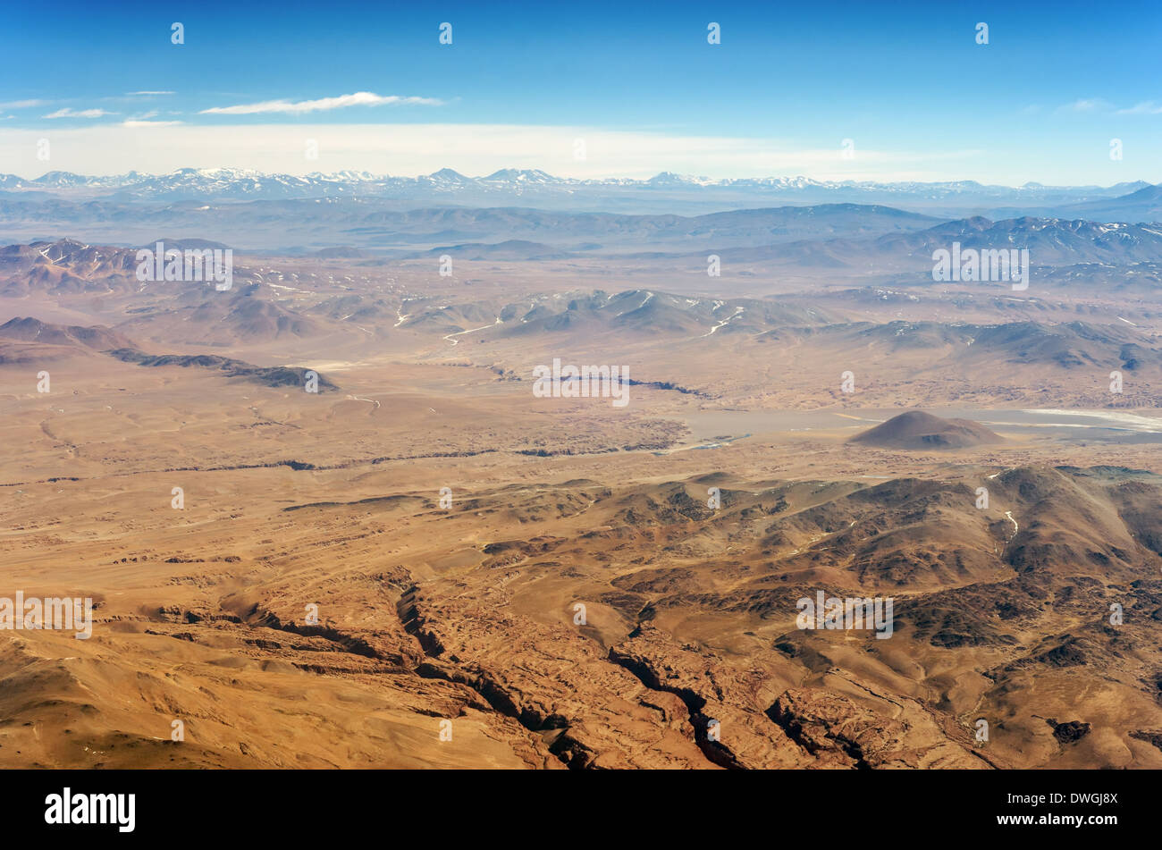 Aerial view of dry desert and the Andes Mountains somewhere over South ...