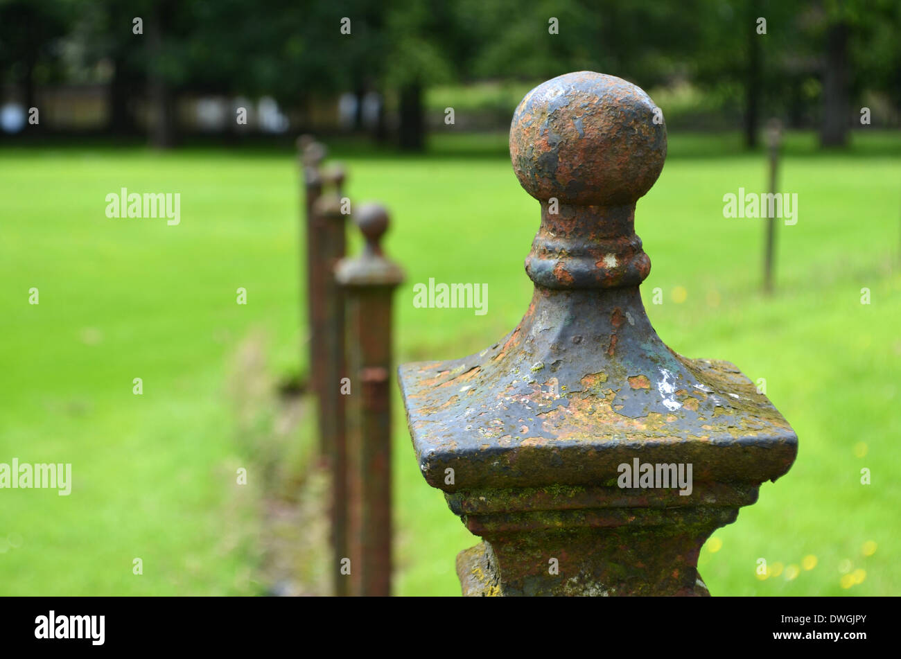 Rusting fence posts in the park waiting to be restored Stock Photo - Alamy