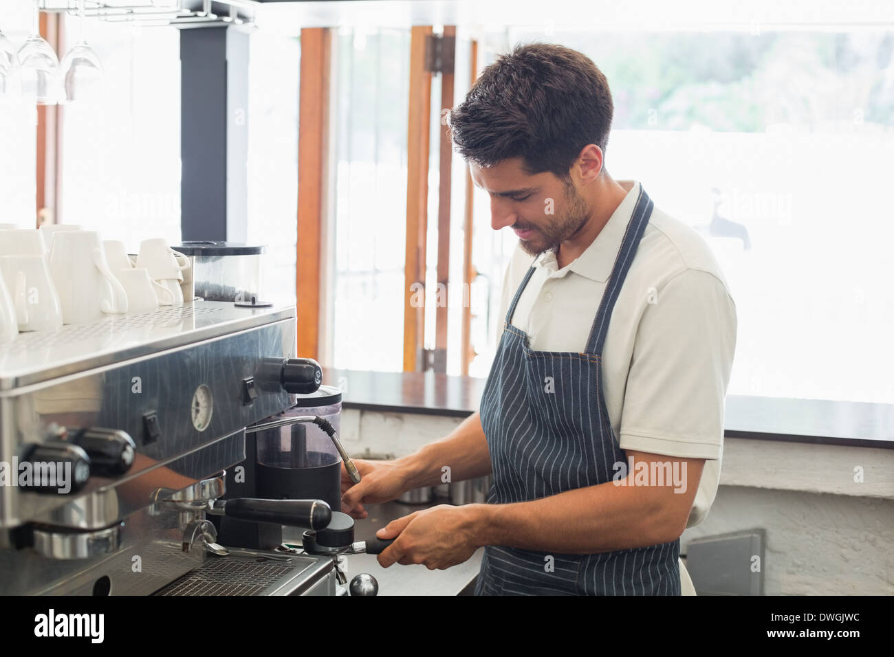 Smiling barista preparing espresso at coffee shop Stock Photo - Alamy