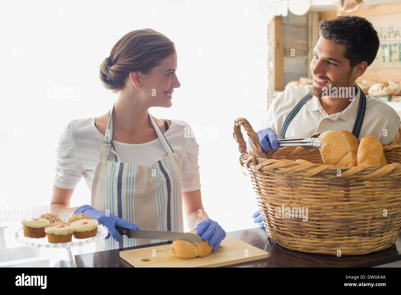 Smiling people with croissants at the coffee shop counter Stock Photo ...