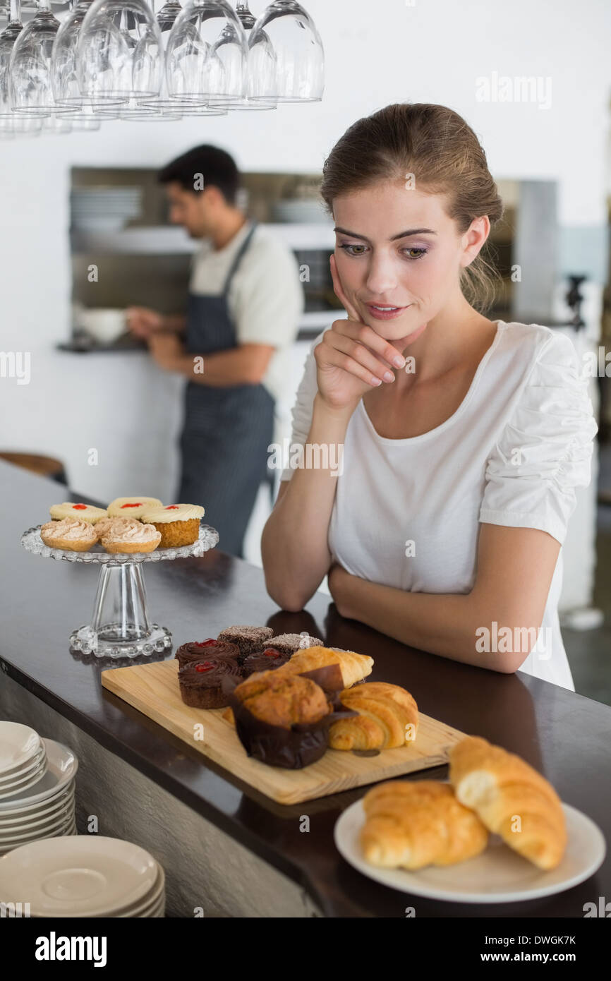 Female cafe owner thinking hi-res stock photography and images - Alamy