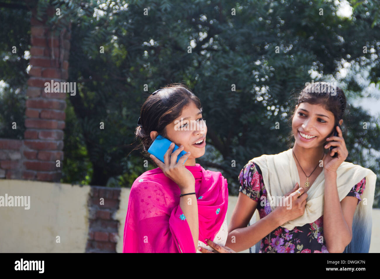 Two girls standing talking hi-res stock photography and images - Alamy