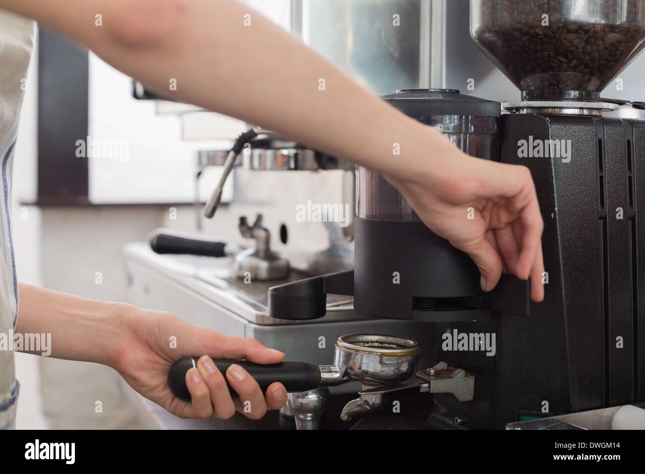 Barista prepares espresso in coffee shop Stock Photo - Alamy