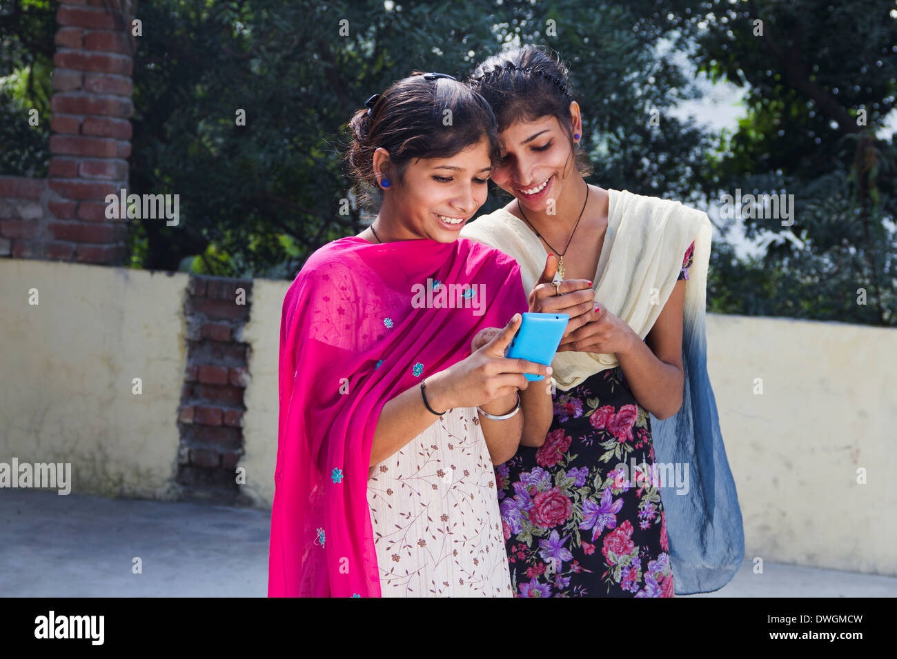 Indian Rural girls talking with mobile phone Stock Photo - Alamy