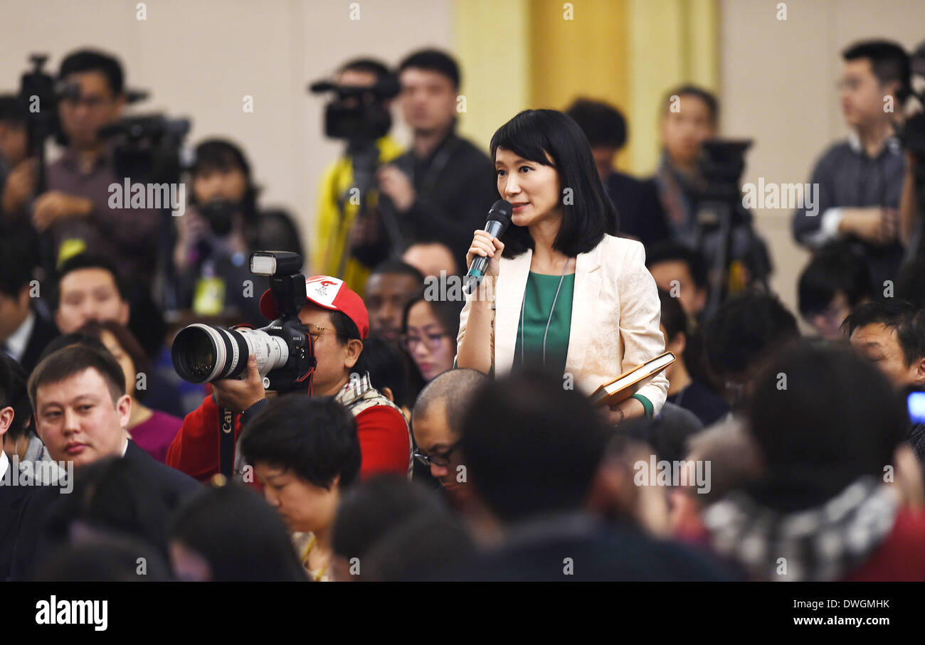 Beijing, China. 8th Mar, 2014. A journalist asks a question at a press ...