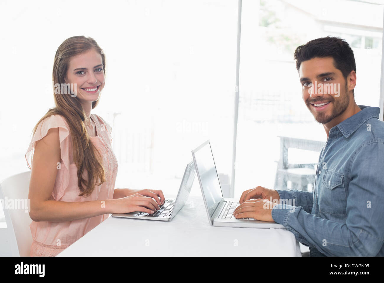 Couple laptops table hi-res stock photography and images - Alamy
