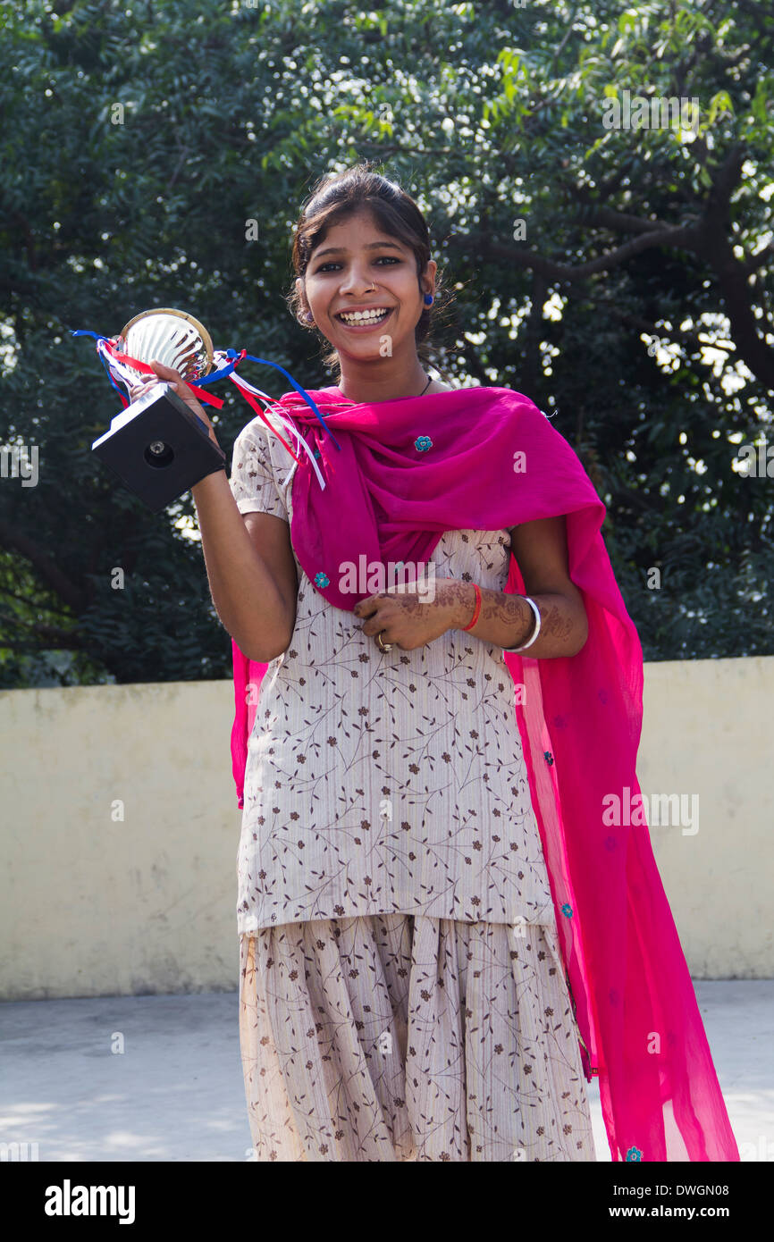 1 Indian Rural Girl standing with trophy Stock Photo - Alamy