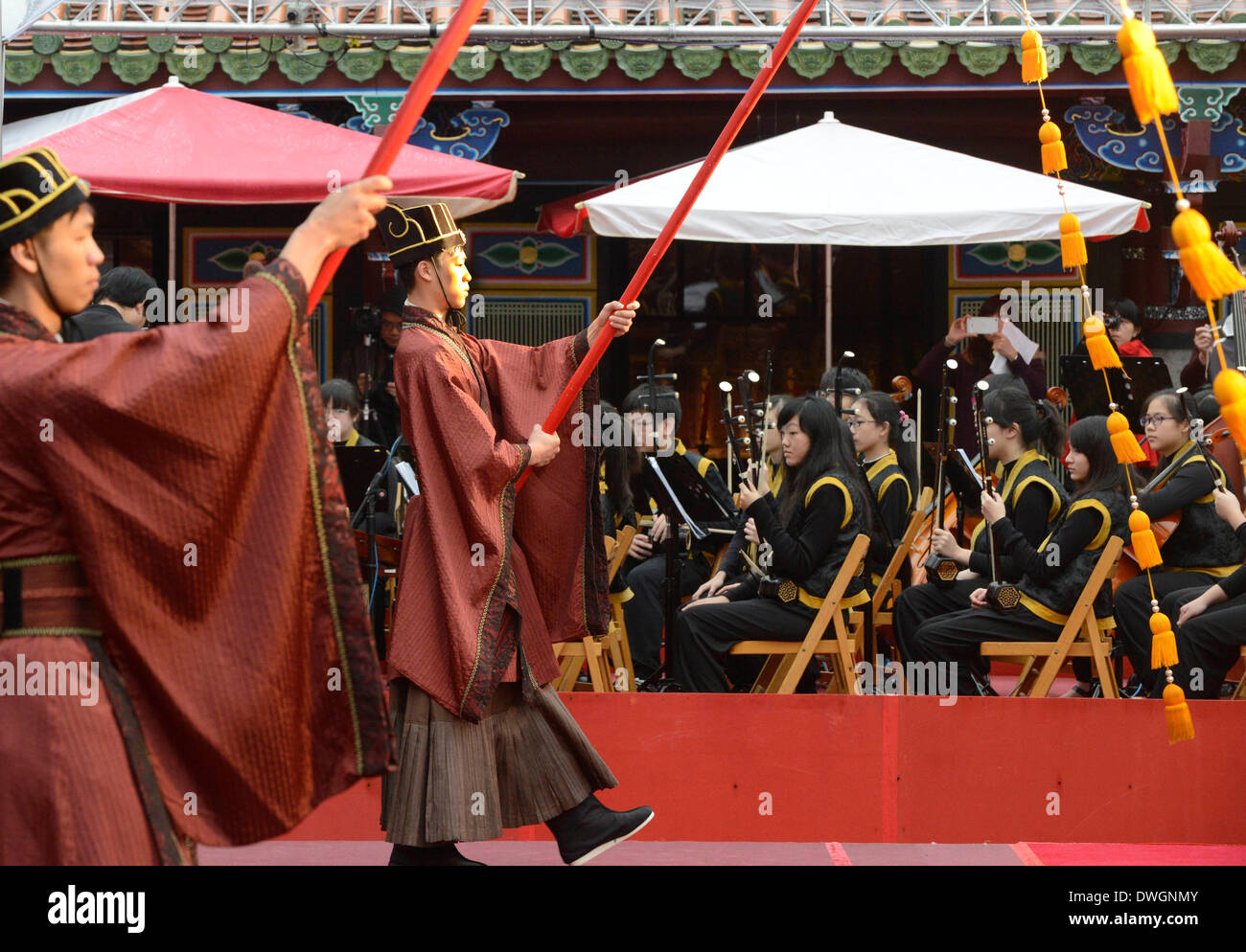 Taipei. 8th Mar, 2014. Members of a ritual dance squad perform during a ...