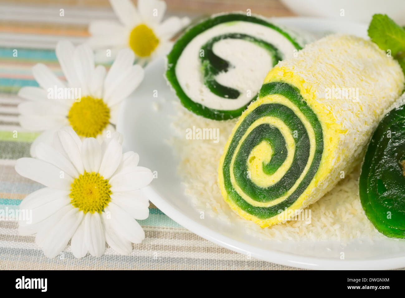 sweet dessert decorated with daisies on a plate Stock Photo - Alamy