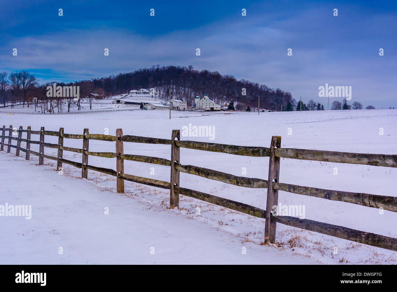 Fence and snow covered farm fields in rural Adam's County, Pennsylvania ...