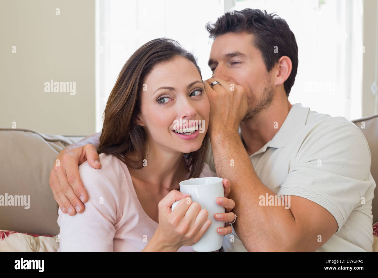 Whispering holding together beautiful hi-res stock photography and ...