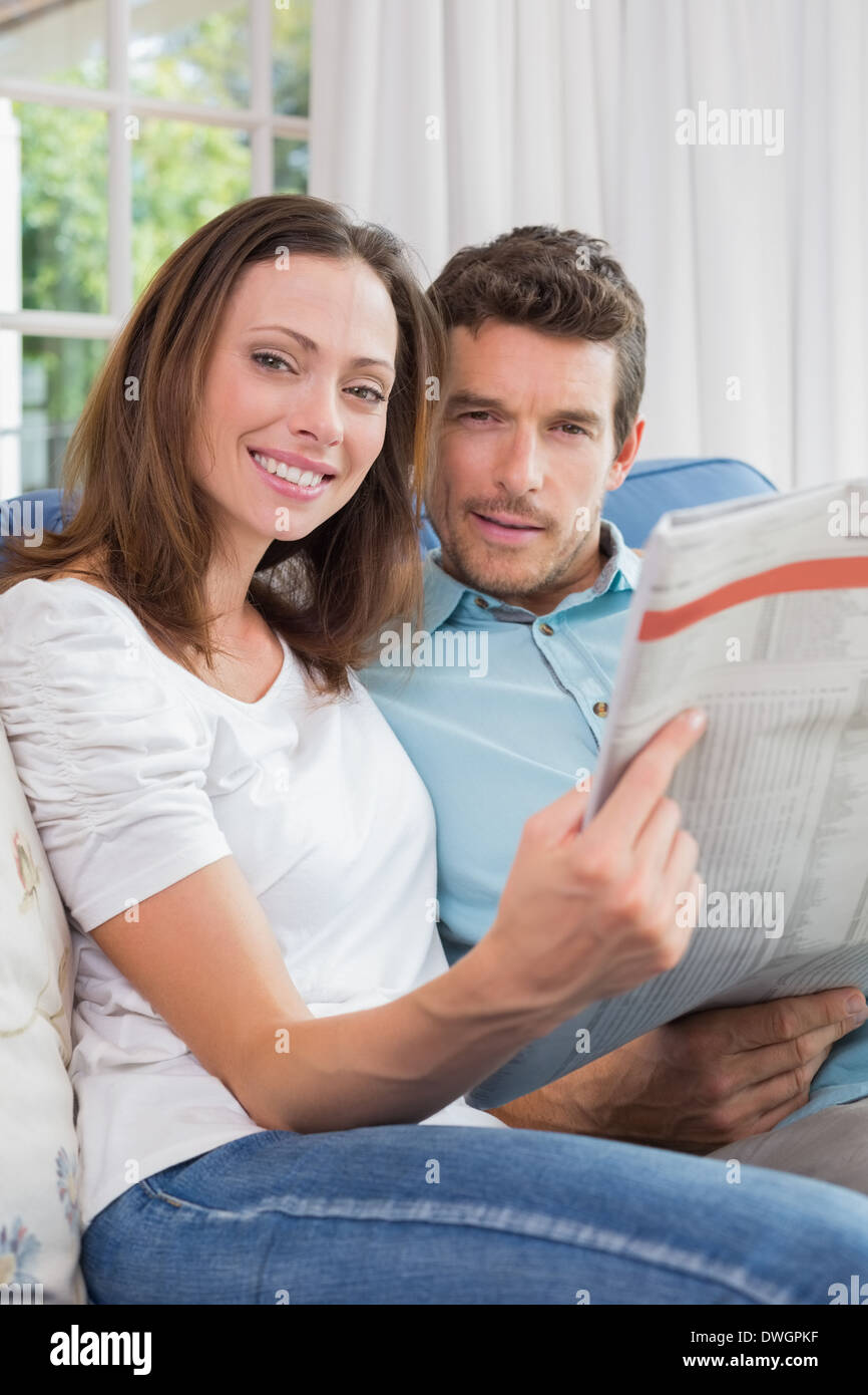 Young couple reading newspaper hi-res stock photography and images - Alamy