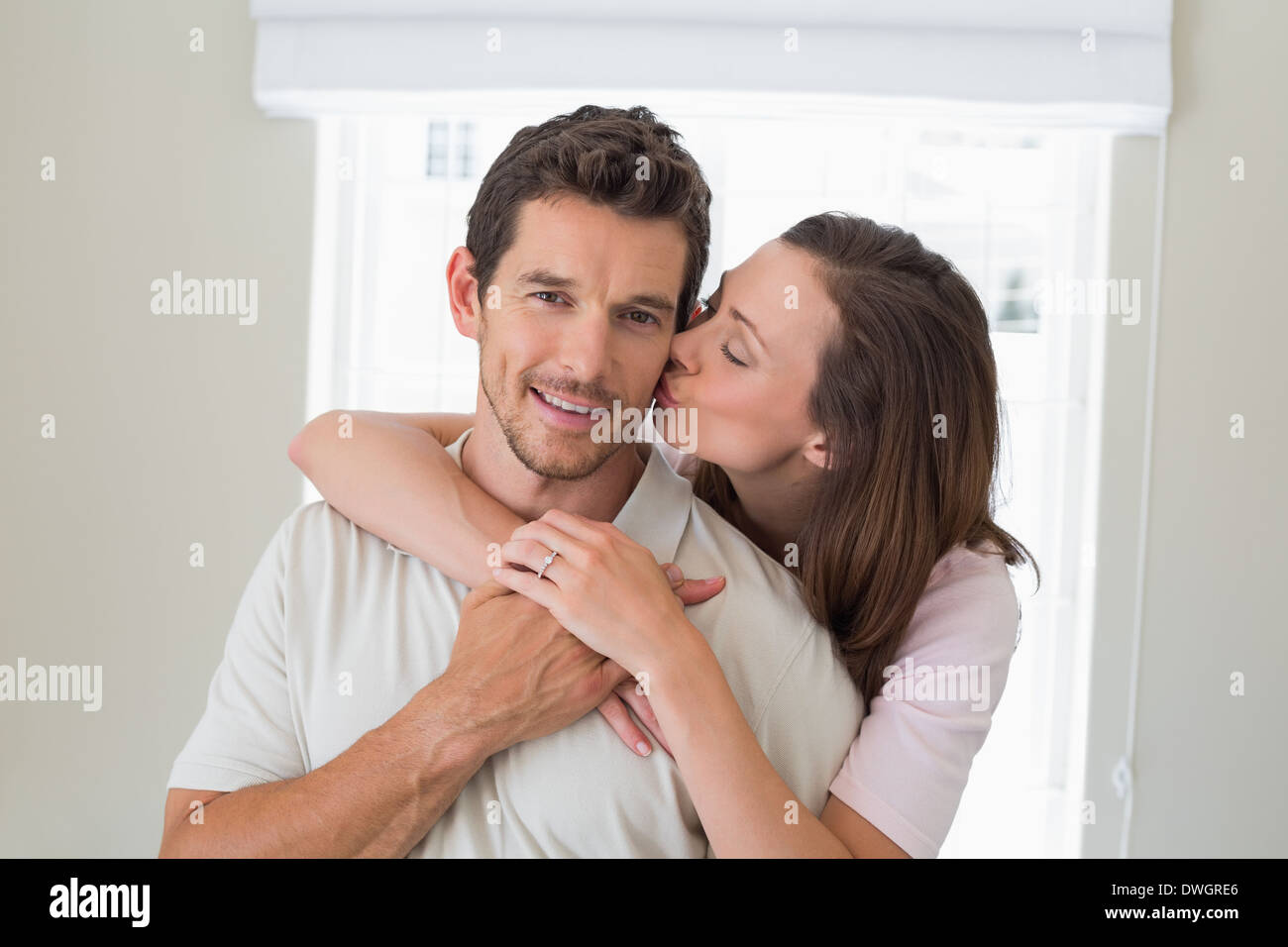 Man kissing woman from behind hi-res stock photography and images - Alamy