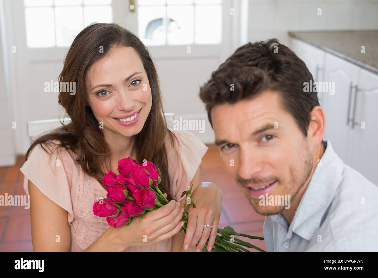 Happy young couple flowers hi-res stock photography and images - Alamy