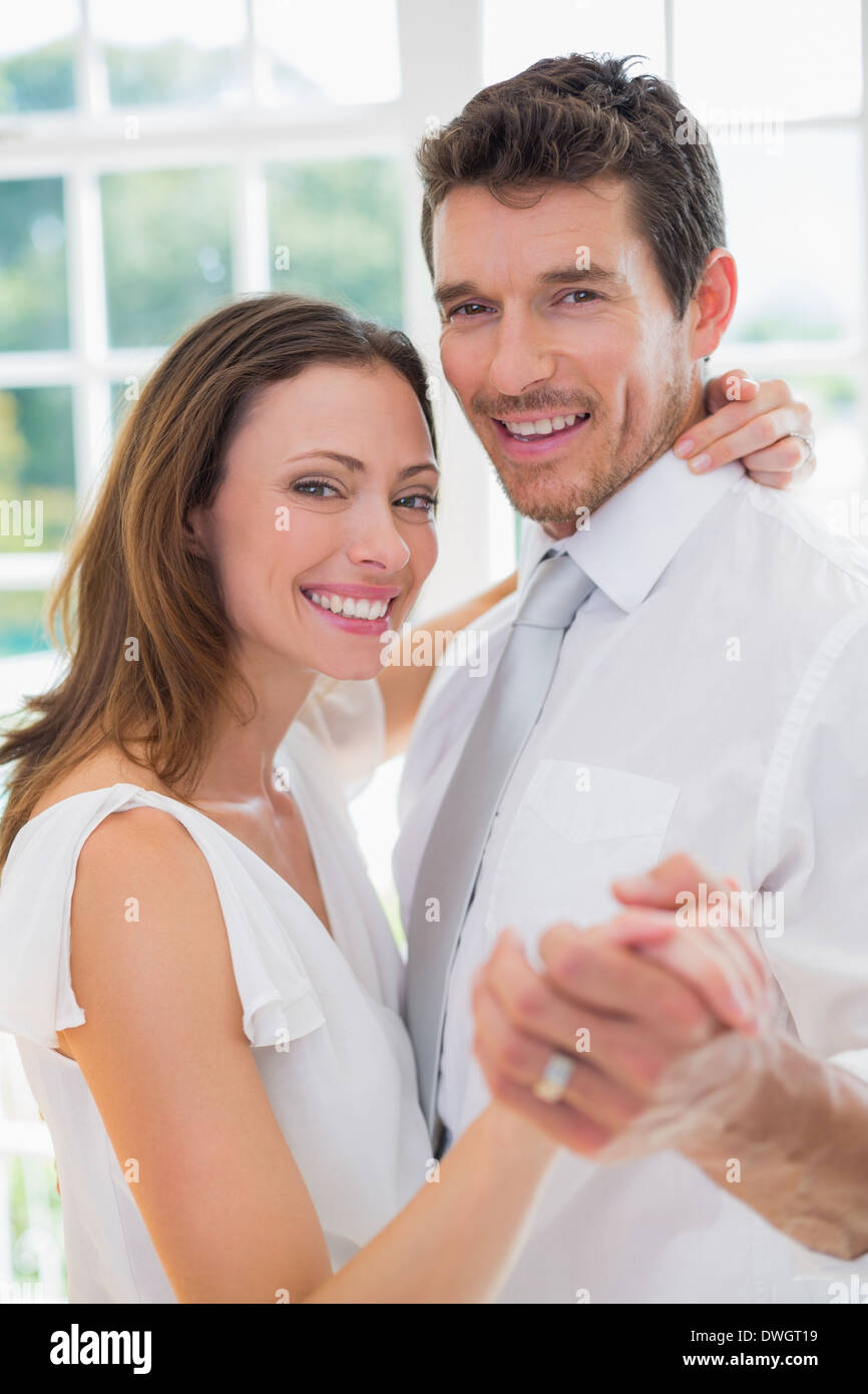 Happy loving couple dancing at home Stock Photo - Alamy