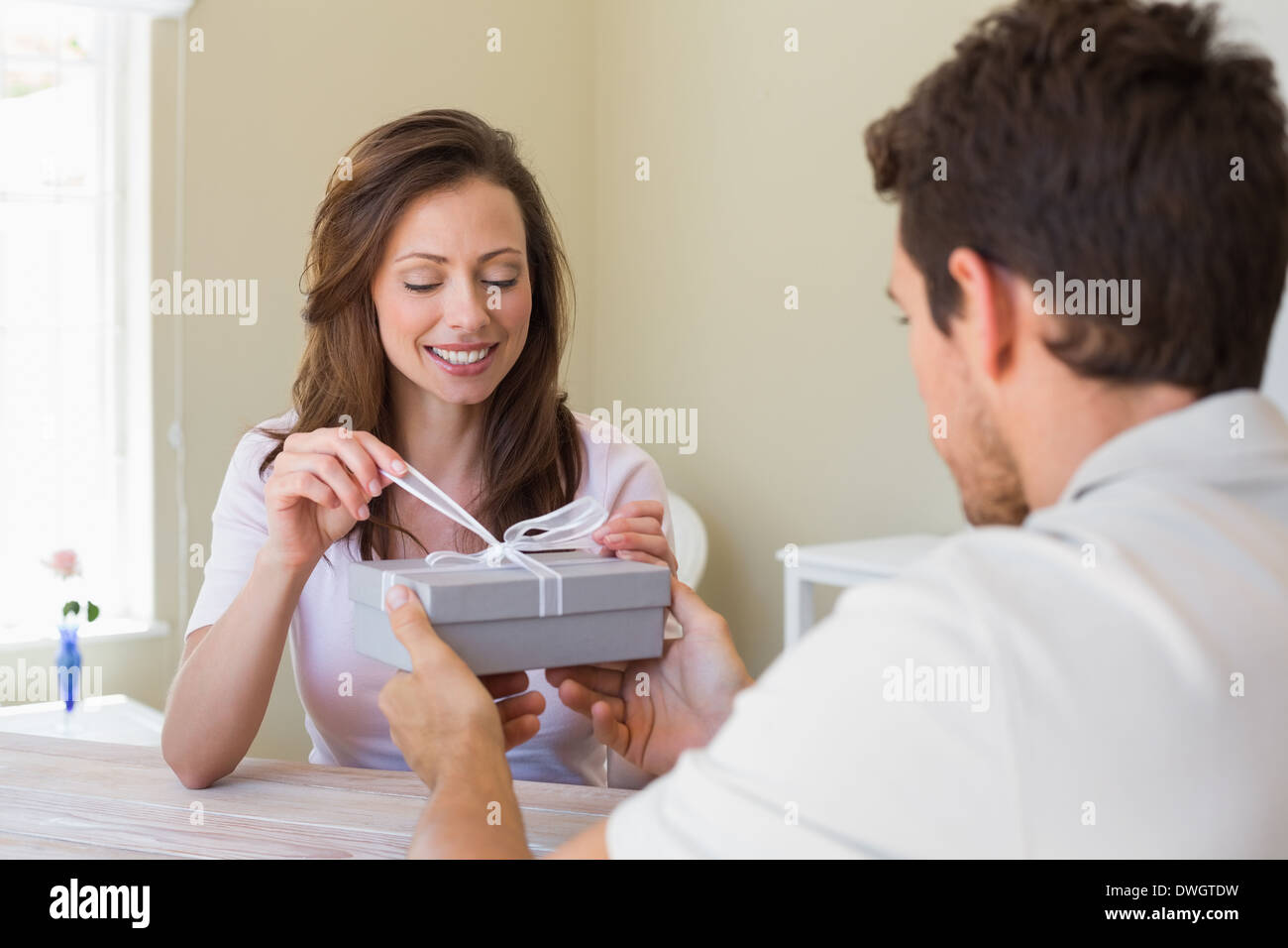 Woman taking gift box hi-res stock photography and images - Alamy