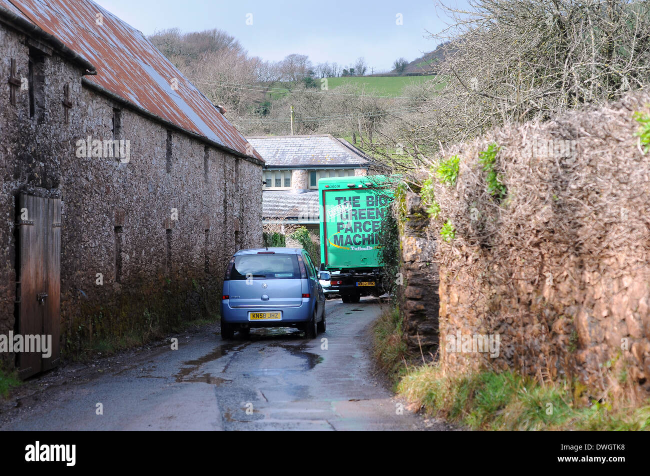 the big green parcel machine van in a rural lane Stock Photo - Alamy