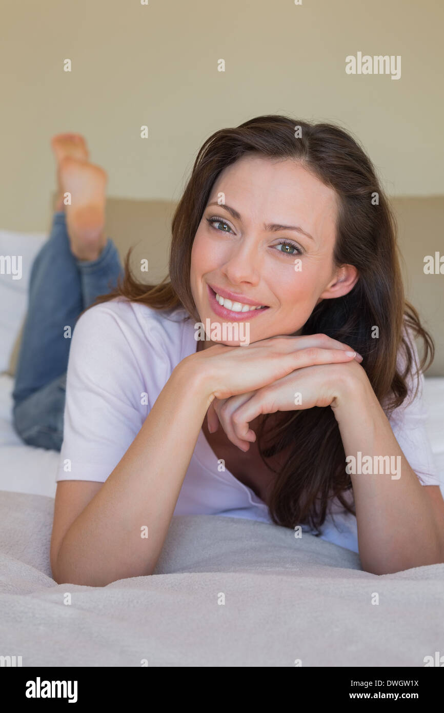 Smiling relaxed young woman hi-res stock photography and images - Alamy