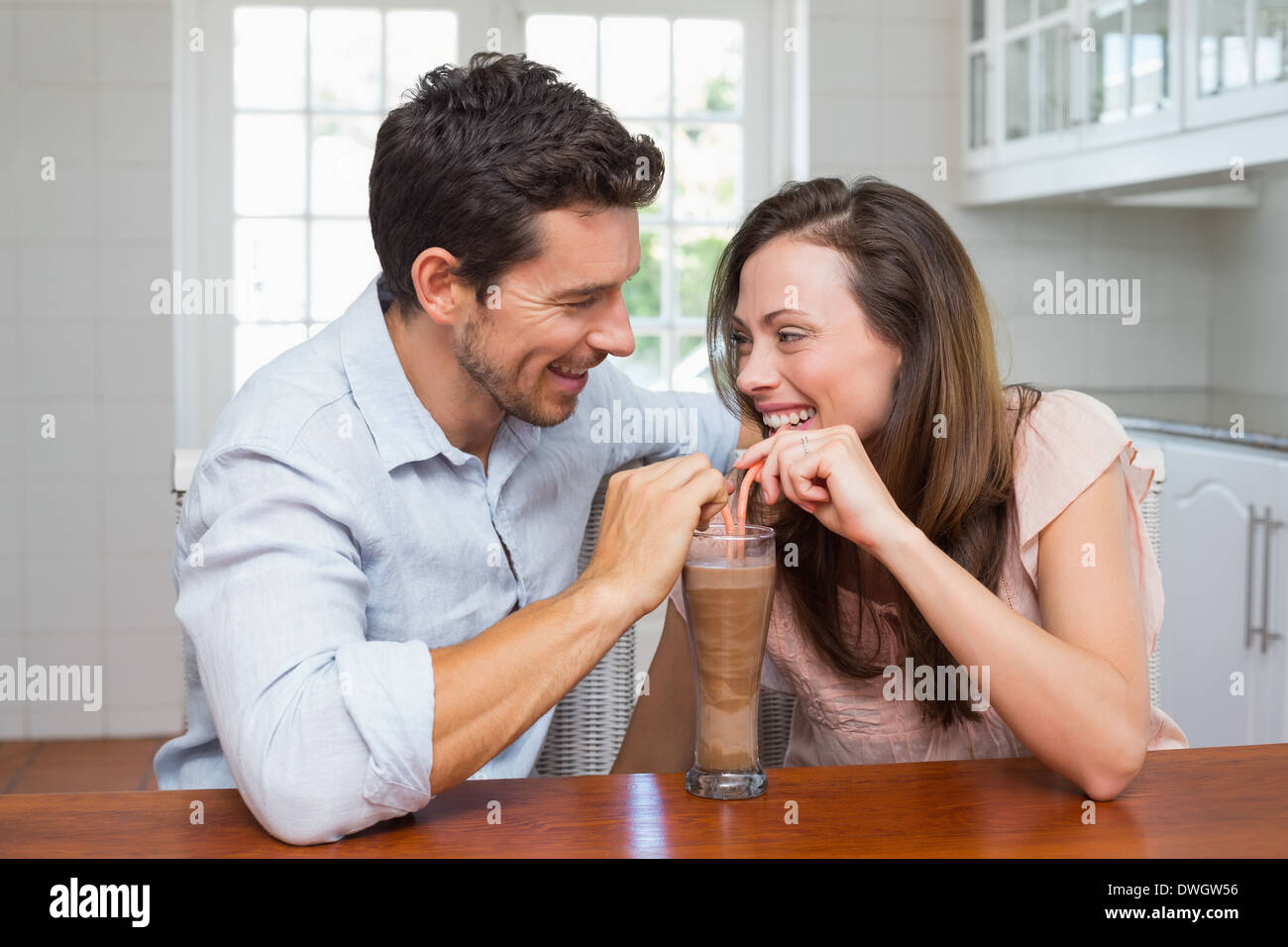 Sharing a drink hi-res stock photography and images - Alamy