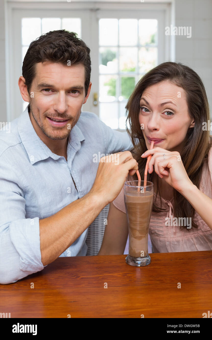Romantic couple sharing glass hi-res stock photography and images - Alamy