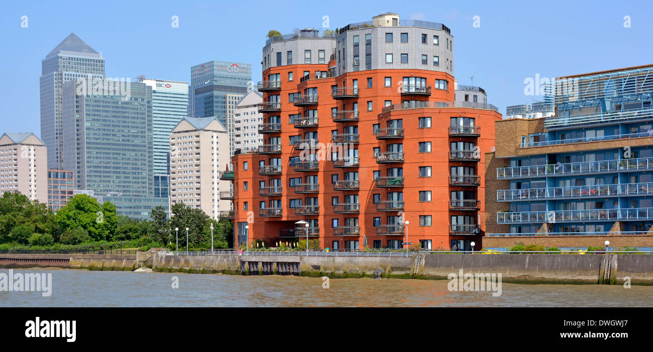London Docklands riverside apartment blocks with Canary Wharf office ...