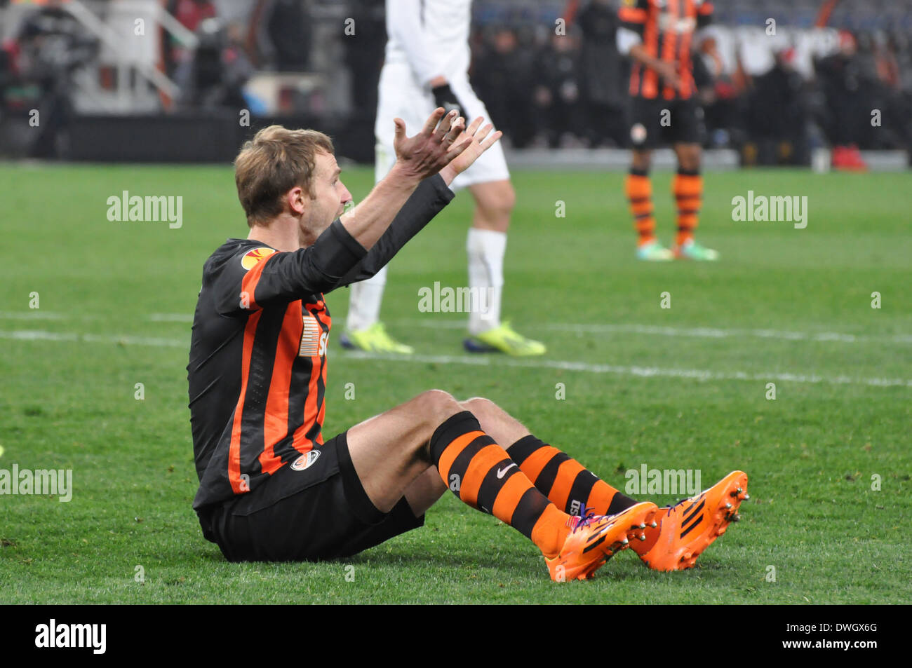 Alexandr Kucher is sitting on the field during the match between ...