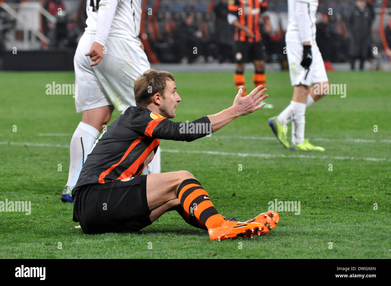 Alexandr Kucher is sitting on the field during the match between ...