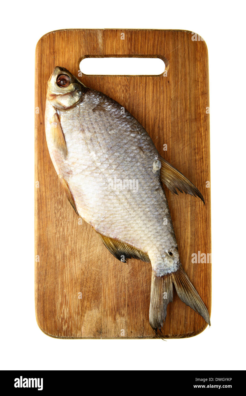 Fish on chopping board isolated over white background Stock Photo - Alamy