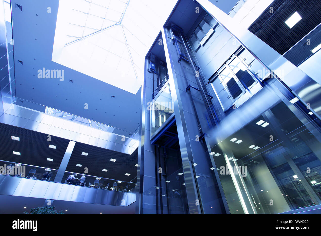 Modern interior of trade center with lift Stock Photo - Alamy