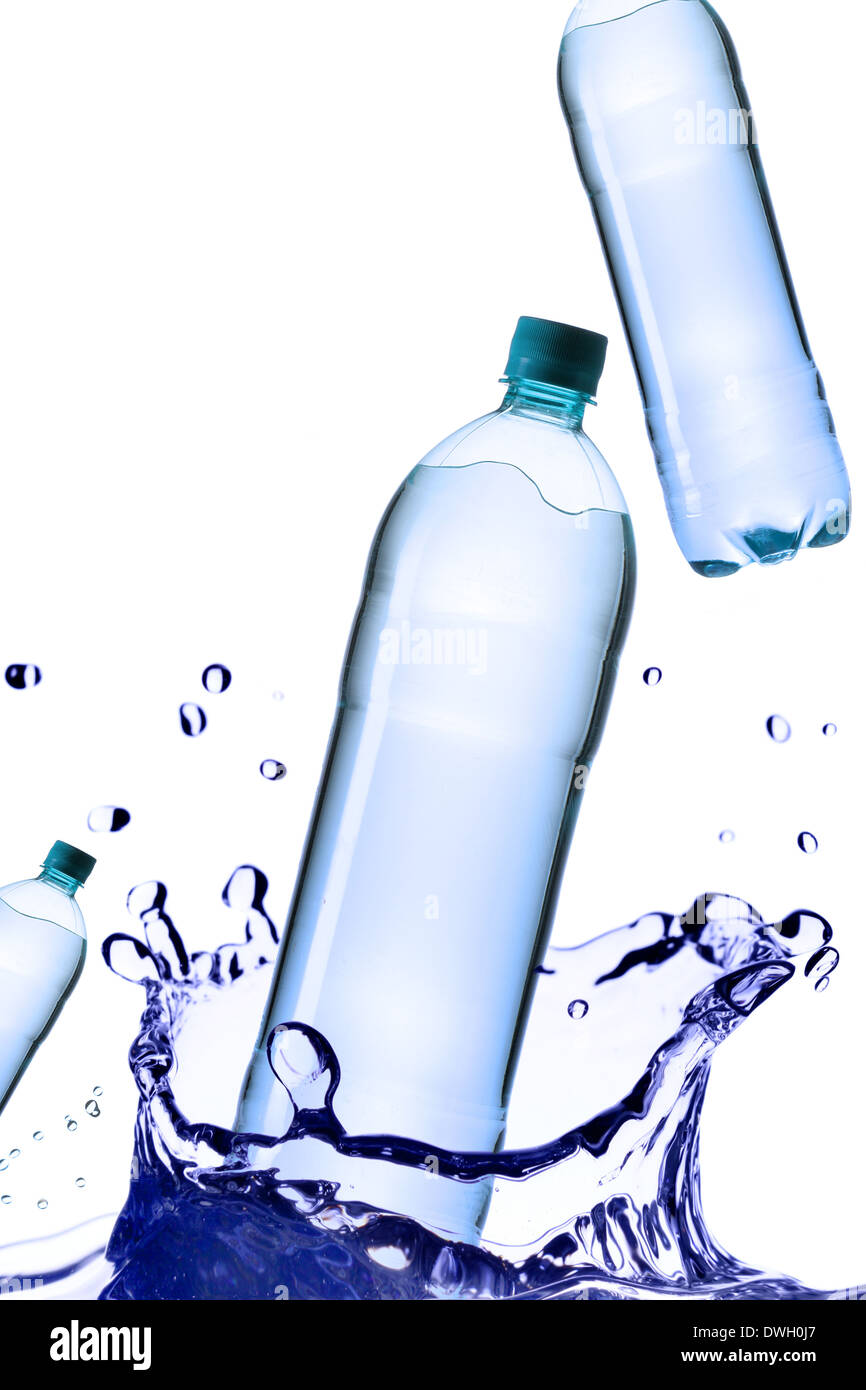 Falling bottles of pure water isolated over white background Stock Photo - Alamy