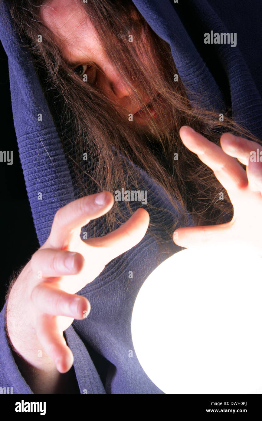 Magician with glowing magical orb close-up Stock Photo - Alamy
