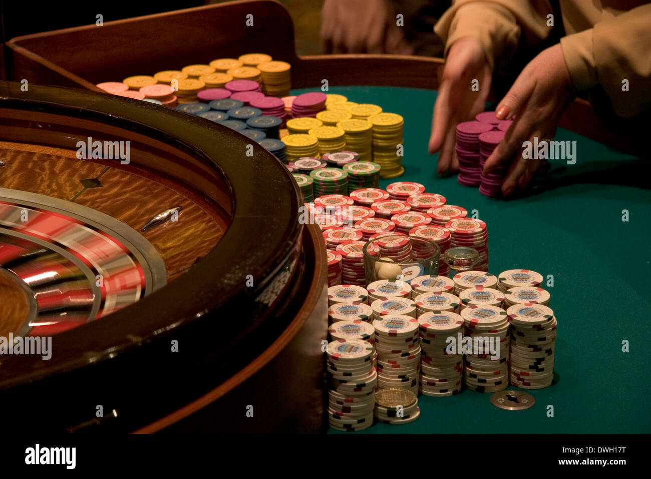 Roulette wheel hands hi-res stock photography and images - Alamy
