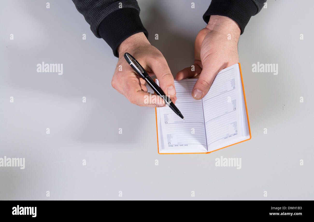 HAND WRITING APPOINTMENT ON AGENDA Stock Photo - Alamy