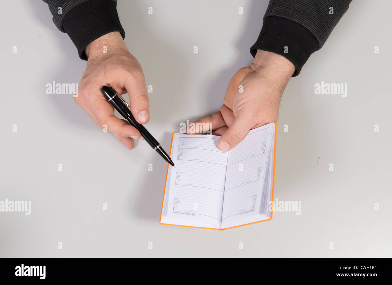 HAND WRITING APPOINTMENT ON AGENDA Stock Photo - Alamy