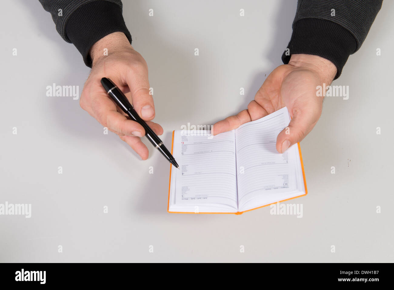 HAND WRITING APPOINTMENT ON AGENDA Stock Photo - Alamy