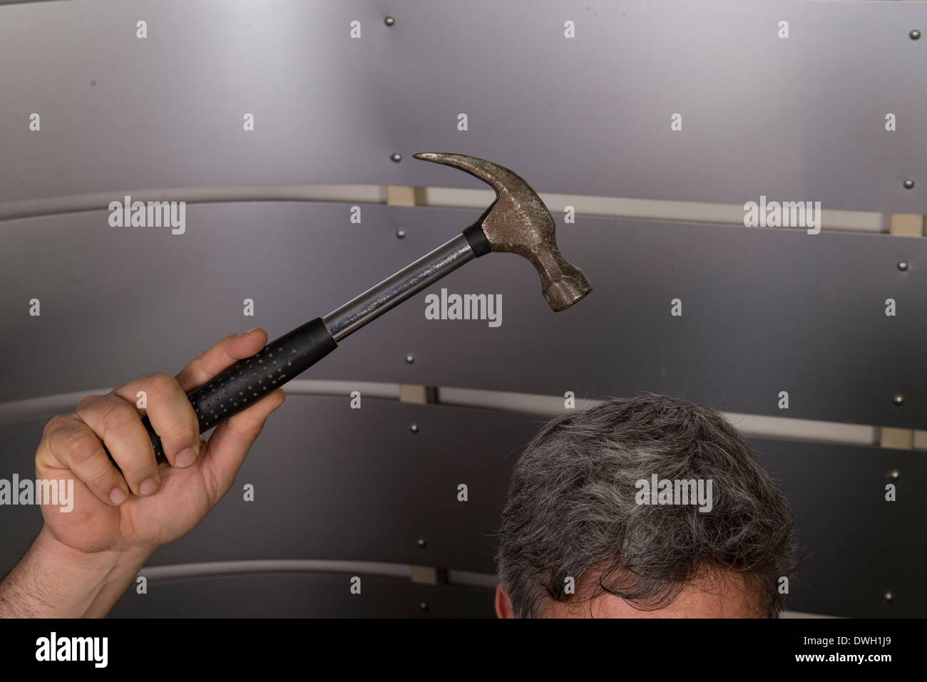 hammer on a head Stock Photo - Alamy