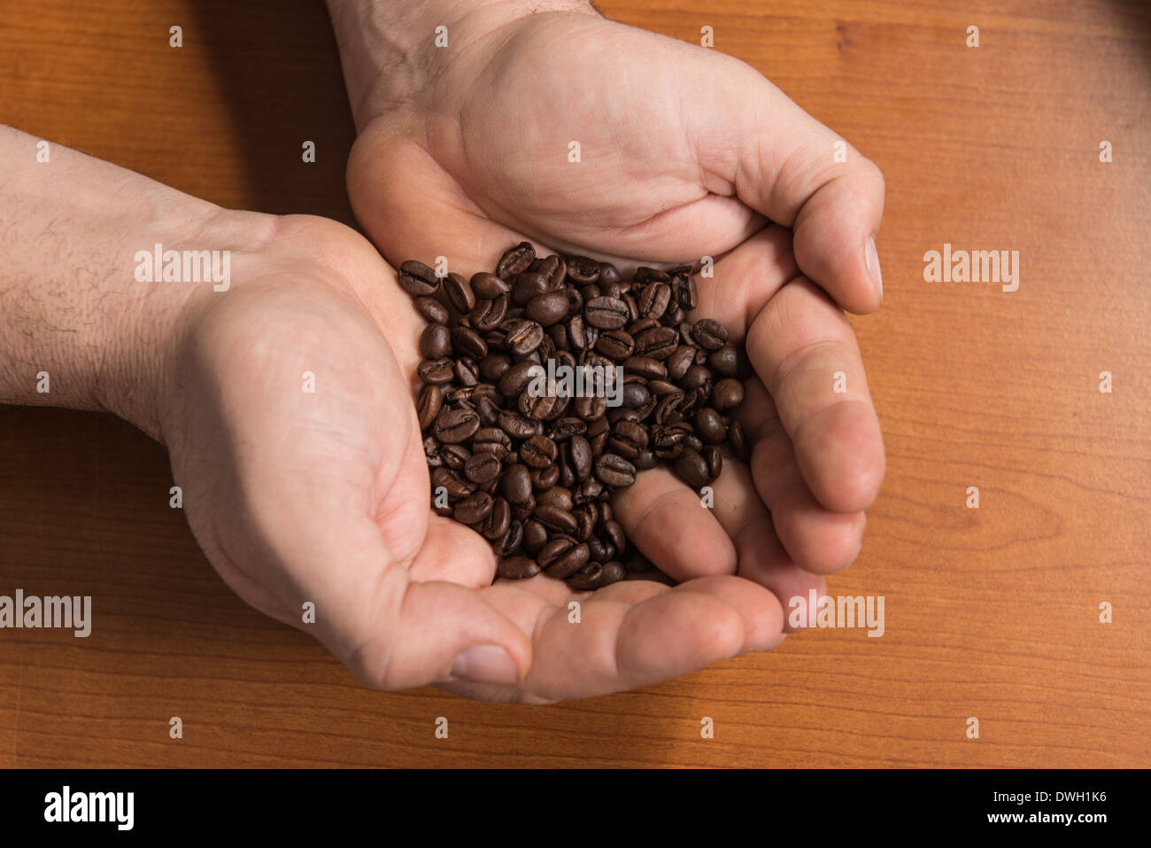 hands and coffee beans Stock Photo - Alamy