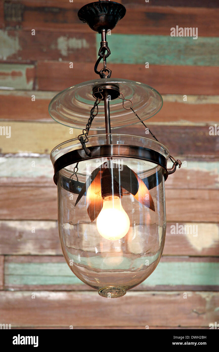 Ancient lamp of old wood background Stock Photo - Alamy